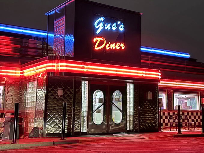 At night, Gus's neon sign glows like a beacon of hope for hungry travelers, promising that yes, you can still get those famous hashbrowns even after the sun goes down.