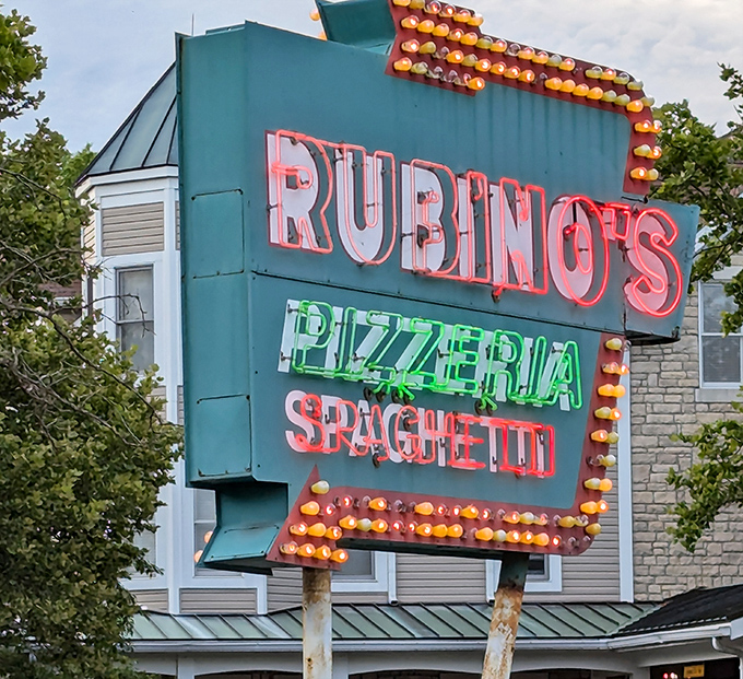 The vintage neon sign glows like a beacon of pizza promise, drawing in generations of Ohioans who know that some treasures don't need updating.