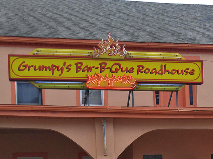 The sign glows like a barbecue North Star, guiding hungry travelers home. Some destinations are worth the journey, especially when they end in smoke and fire.