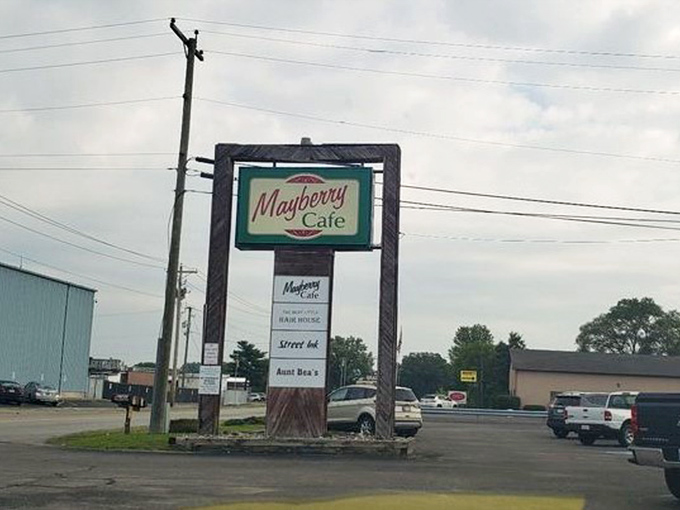 Standing tall against the Indiana sky, the Mayberry Cafe sign serves as a beacon for hungry travelers seeking a taste of nostalgia.