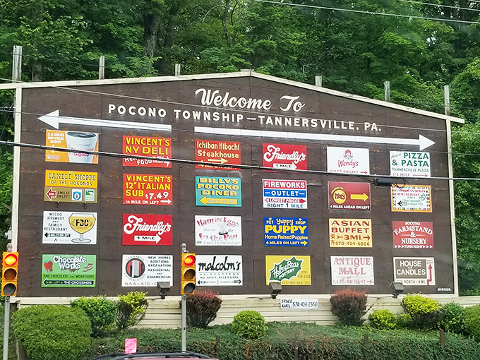 Welcome to Pocono Township sign displaying local business pride with the enthusiasm of a small-town chamber of commerce.
