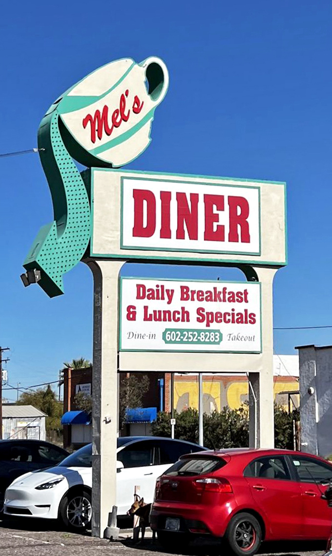 The iconic coffee cup sign stands tall against the Arizona blue&mdash;a beacon of breakfast hope for hungry travelers and locals alike.