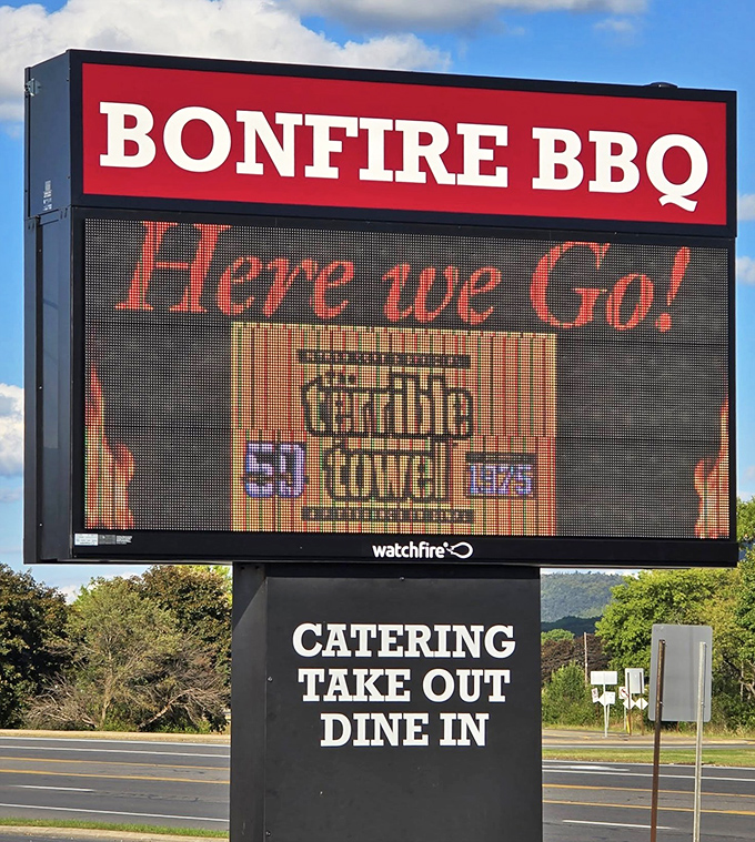 The roadside sign announces Bonfire's presence like a beacon to hungry travelers – salvation for empty stomachs ahead.