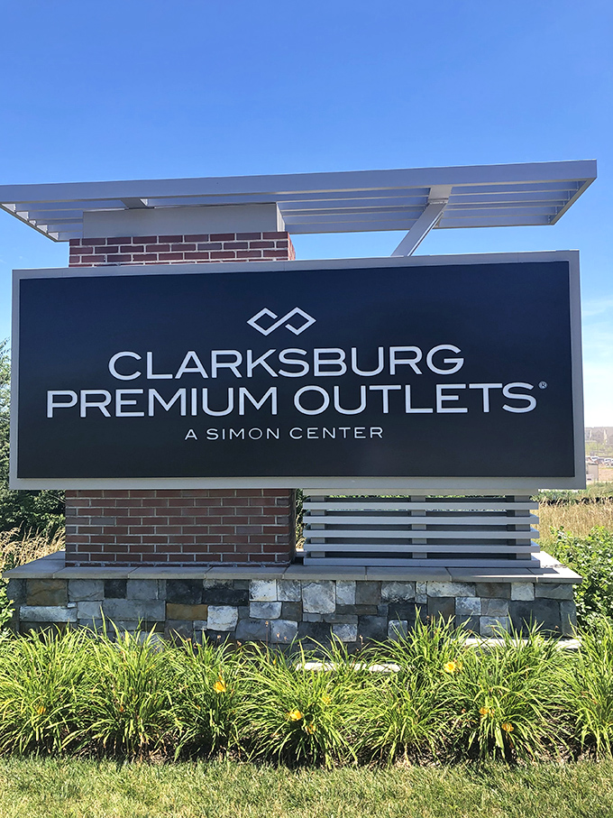 The official welcome sign stands proud, like a retail version of the Hollywood sign, beckoning bargain hunters from miles around.