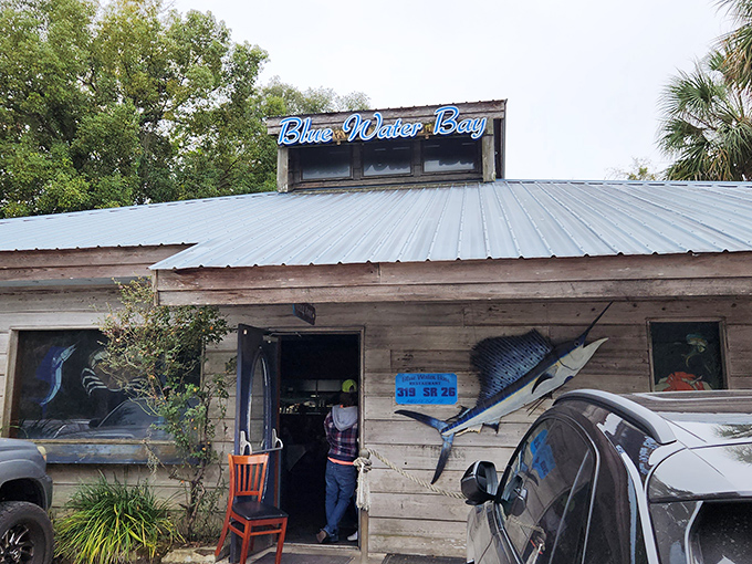 The Blue Water Bay sign promises what's inside: authentic Florida seafood with no pretense, just honest-to-goodness deliciousness.