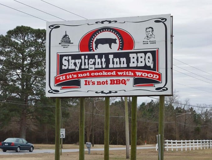 The roadside declaration that leaves no room for debate: "If it's not cooked with wood, it's not BBQ." Fighting words in some states, gospel truth in Ayden.