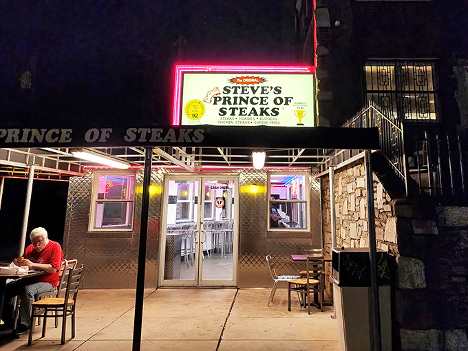 The neon glow of Steve's sign cuts through the night, a lighthouse guiding the cheesesteak-starved to safe harbor.