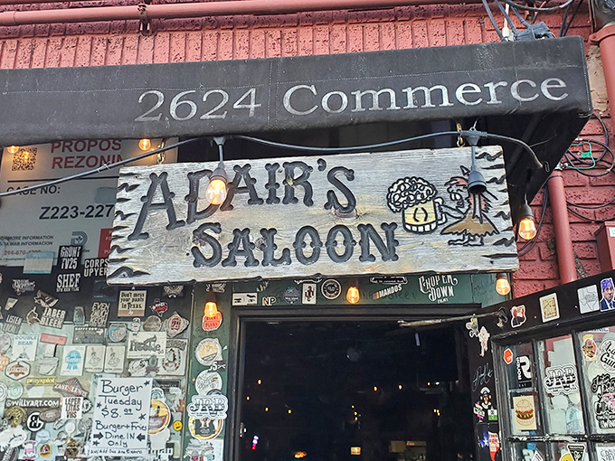 That weathered wooden sign doesn't need neon or flash&mdash;like the burgers served beneath it, it's straightforward, authentic, and instantly recognizable.