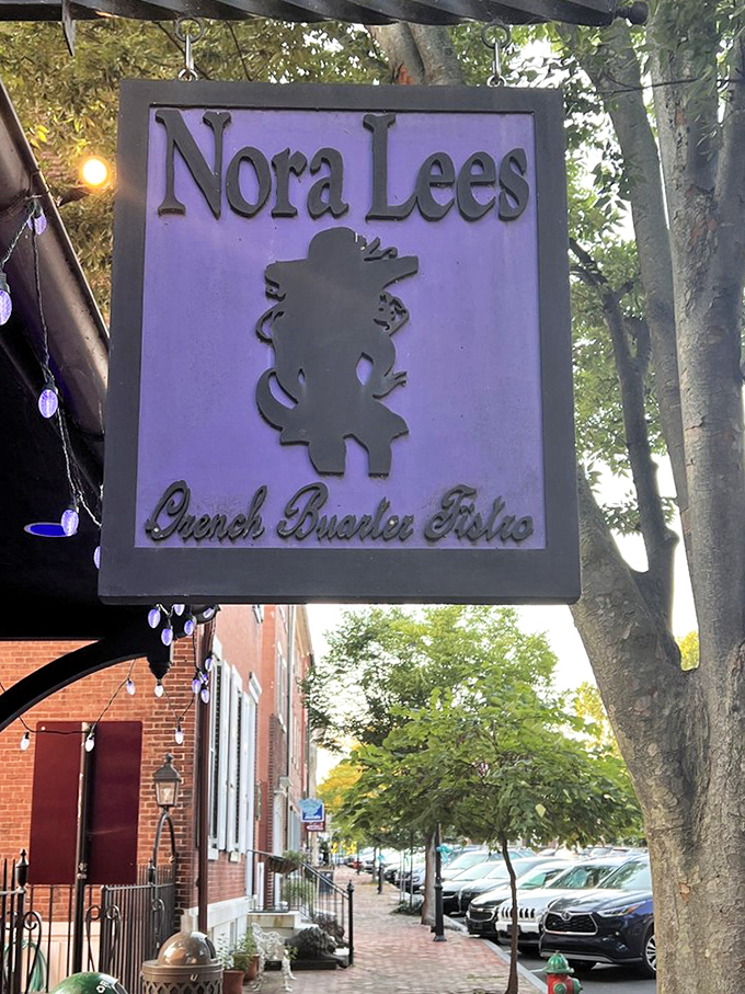 The purple sign stands as a beacon for hungry travelers. Like a lighthouse, but instead of avoiding rocks, you're heading straight for flavor.