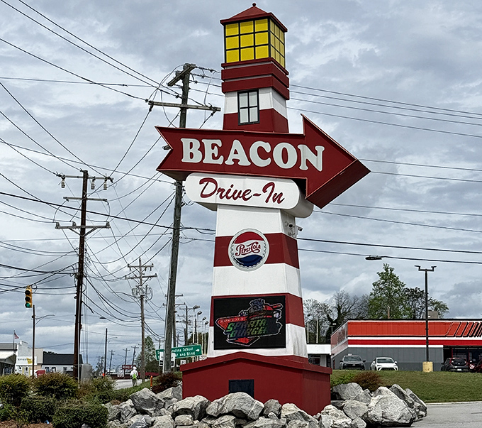 This isn't just a sign—it's a beacon of hope for hungry travelers and a lighthouse guiding you to burger paradise since the mid-20th century.