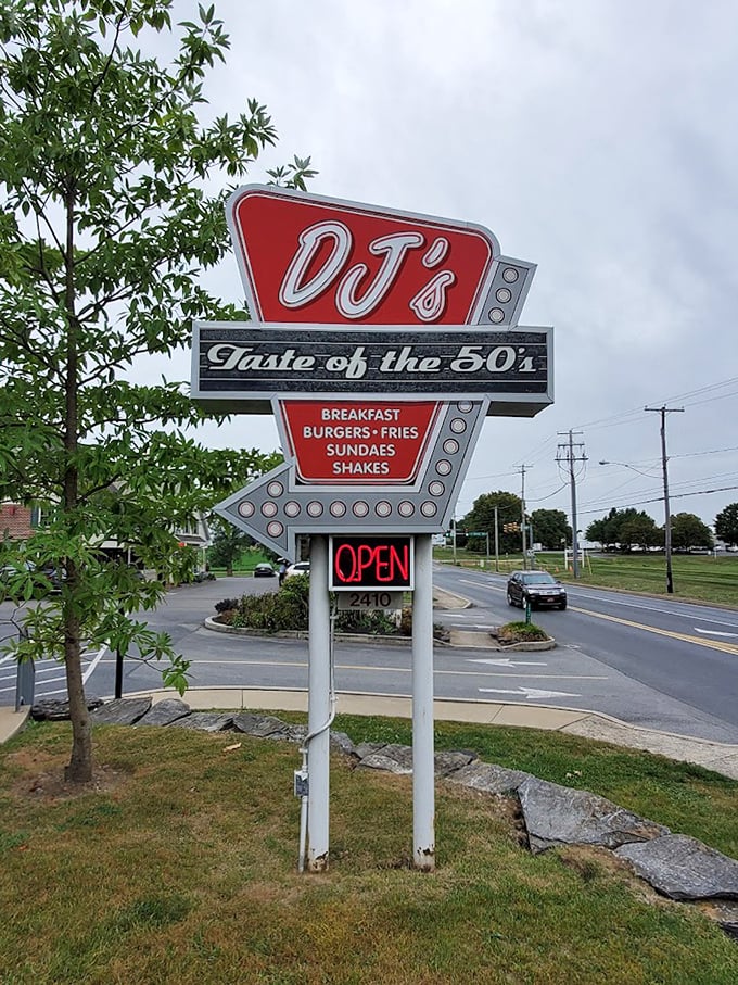 That sign isn't just announcing a restaurant&mdash;it's broadcasting a time machine. Classic arrow design pointing directly to your next food adventure.