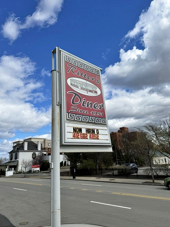 Against blue Pittsburgh skies, the Ritter's sign stands tall. A red beacon of hope for empty stomachs since 1951.
