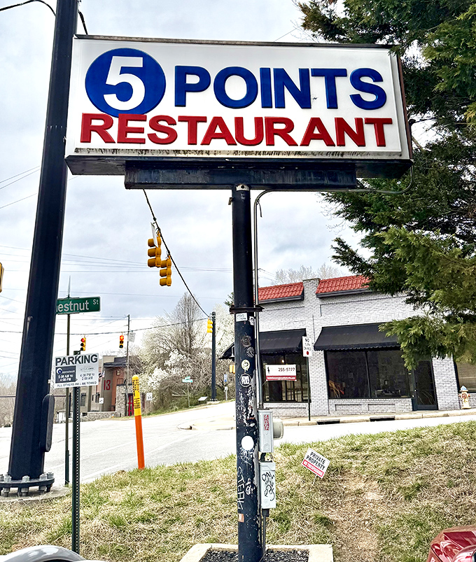 The Five Points sign stands tall, a beacon of hope for the hungry. In a world of uncertainty, this sign promises something reliable: excellent biscuits and gravy.