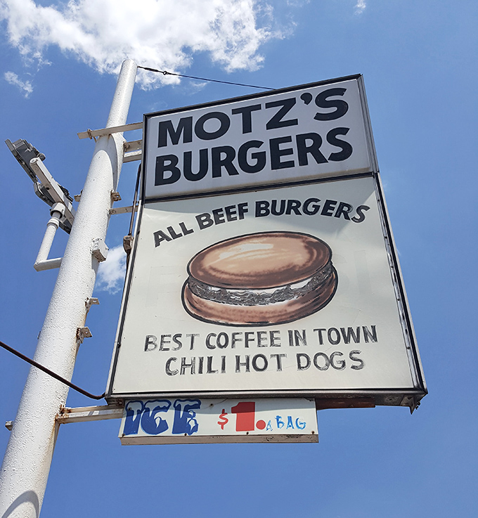 The sign promises "ALL BEEF BURGERS" and "BEST COFFEE IN TOWN"&mdash;straightforward claims from a place that lets its food do the talking.