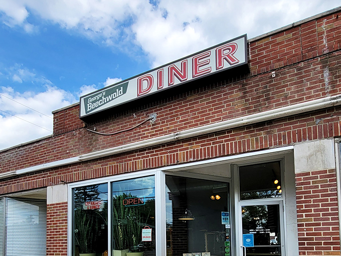 No fancy architectural flourishes needed&mdash;just a simple brick building with a sign that promises exactly what you'll find inside: an authentic diner experience.