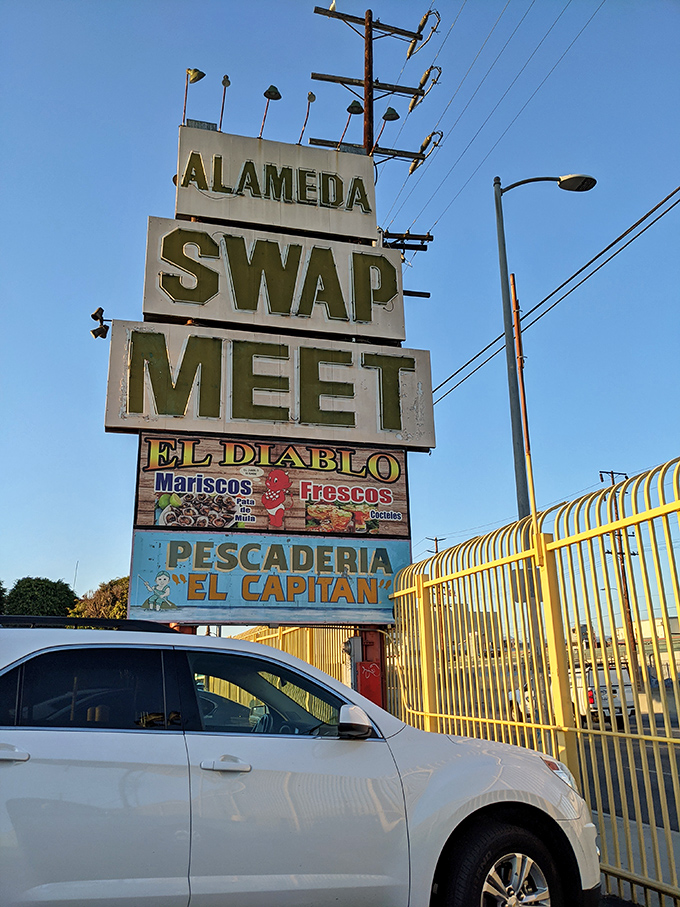The welcome sign to your monthly adventure, where "swap meet" translates to "prepare your wallet for battle."