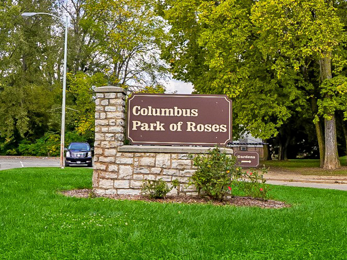 The entrance sign: your portal to 13 acres of floral therapy. No prescription needed, just comfortable walking shoes.