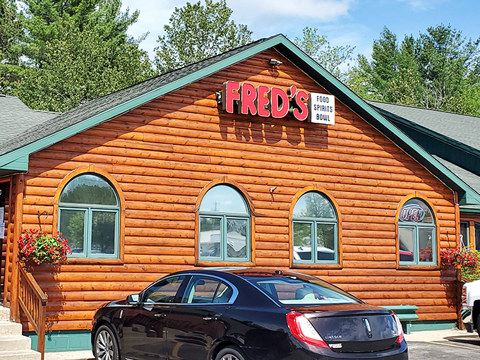In summer, Fred's orange exterior glows like a sunset against Michigan's greenery, promising culinary delights that match the natural beauty surrounding it.