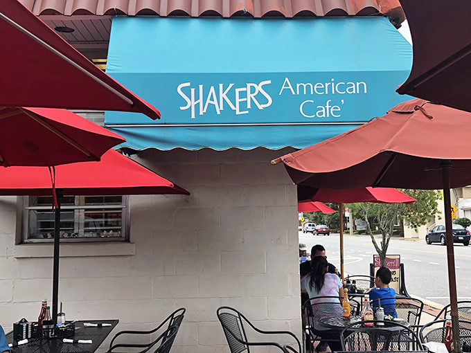 The sign says it all – Shakers American Café – where breakfast isn't just a meal, it's an institution under a turquoise banner.
