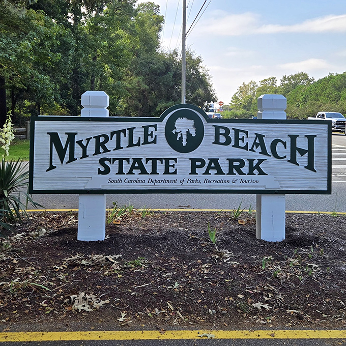 The official welcome sign stands guard at the entrance. Your passport to coastal paradise requires no stamps—just an appreciation for beauty.
