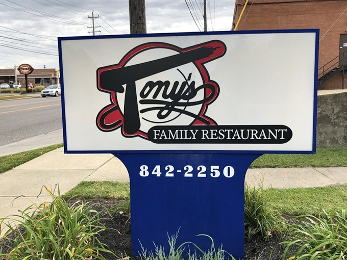 The sign stands as a beacon to hungry travelers, promising not just a meal but an institution where food and community share the spotlight.