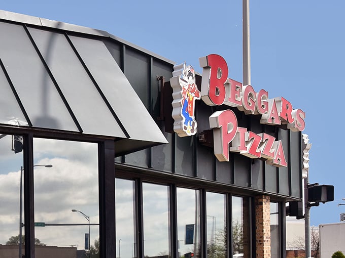 That iconic sign beckons hungry travelers like a lighthouse for the culinarily adrift &ndash; promising safe harbor for pizza and burger cravings alike.