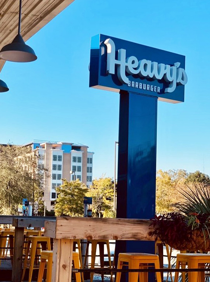 Against Charleston's blue sky, Heavy's sign stands tall &ndash; a beacon of burger hope in a world of unnecessary food complications.