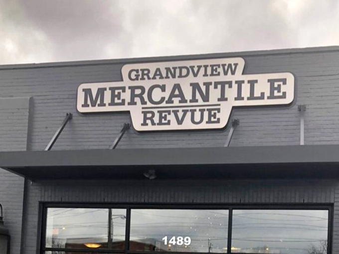 The Grandview Mercantile sign glows against moody skies, a beacon for design enthusiasts. Like the Bat-Signal, but for people whose superpower is spotting exceptional furniture.
