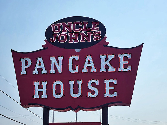 The iconic sign stands against the sky like a red-and-white promise &ndash; here, beneath this banner, pancake dreams come true.