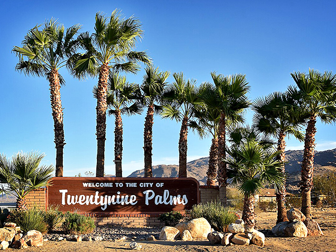 Welcome to Twentynine Palms &ndash; where they've thoughtfully arranged exactly that many palms behind the sign. (Okay, I didn't count them.)