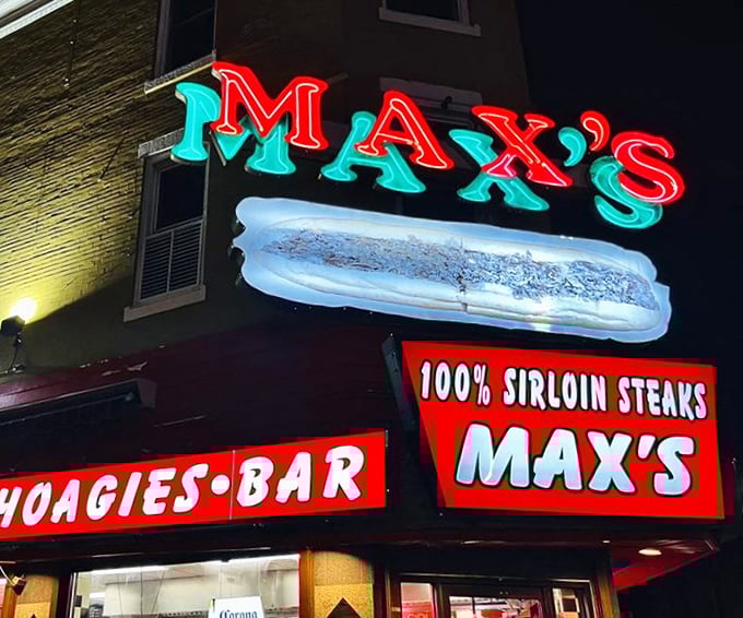 At night, Max's neon sign transforms into a North Philly lighthouse, guiding the hungry home to cheesesteak paradise.