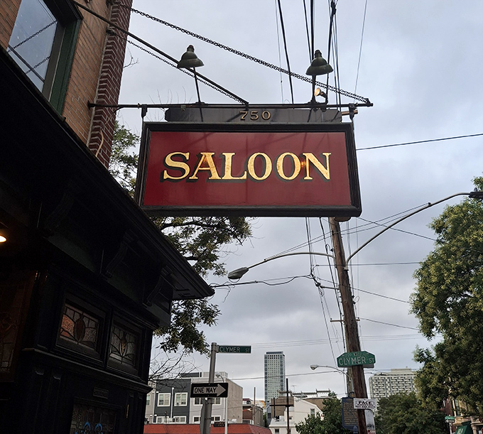 The Saloon sign against Philadelphia's urban backdrop—a landmark that says "turn here for memories that will outlast your diet resolutions."