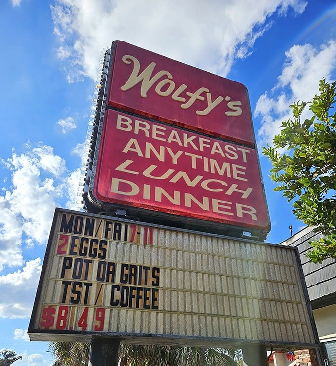 The iconic Wolfy's sign against Florida's blue sky&mdash;a beacon of hope for the hungry and a landmark for locals in the know.