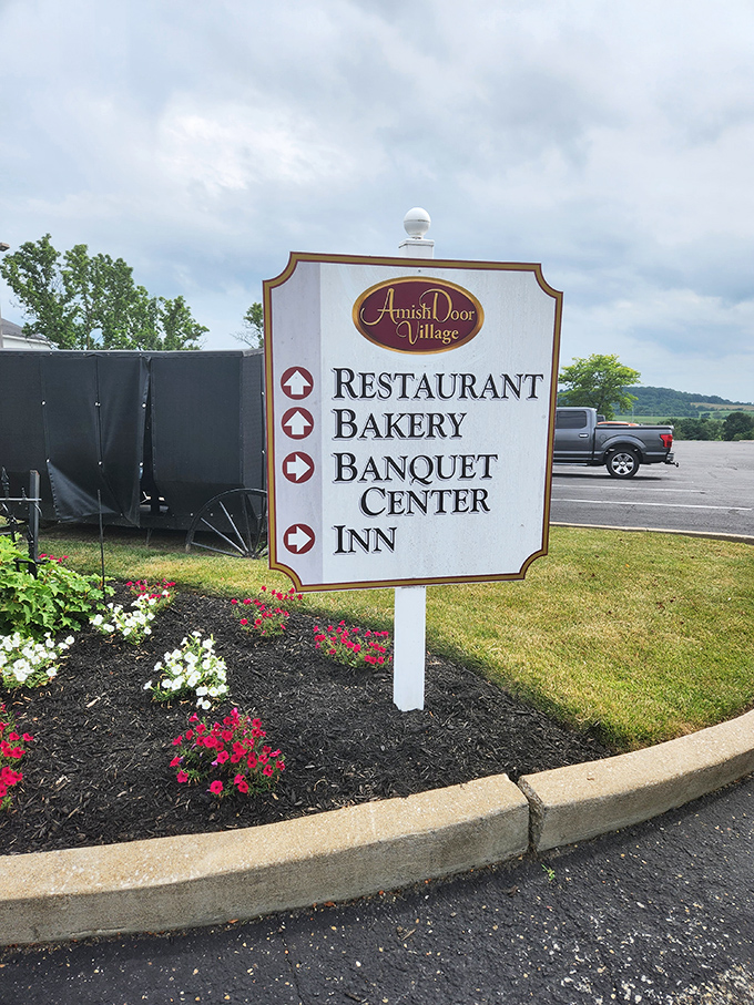 The sign doesn't just point the way—it promises four different paths to happiness, all conveniently located in one village.