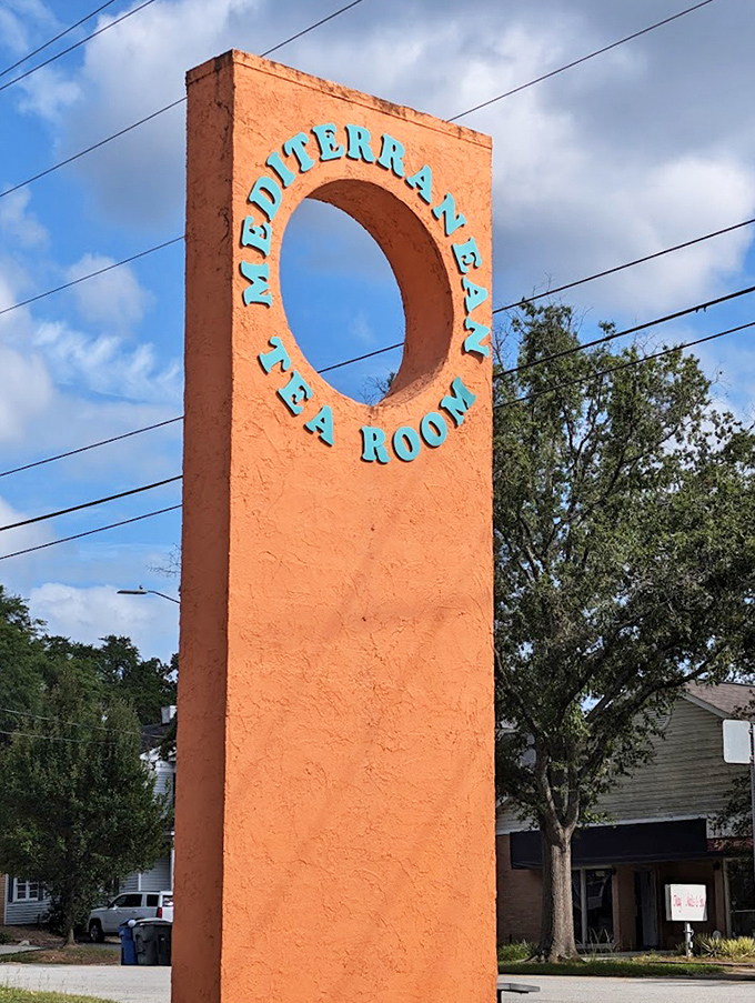 The distinctive orange monument sign stands tall, a beacon for those seeking Mediterranean salvation in the heart of South Carolina.
