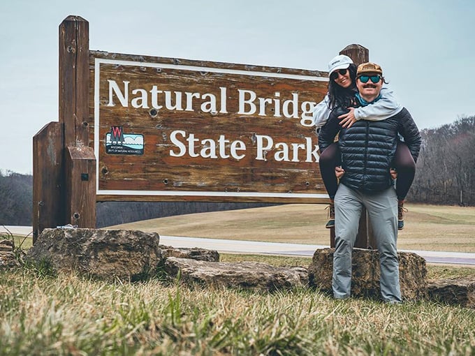 The gateway to adventure awaits. This wooden sign marks the boundary between ordinary life and extraordinary natural wonders.