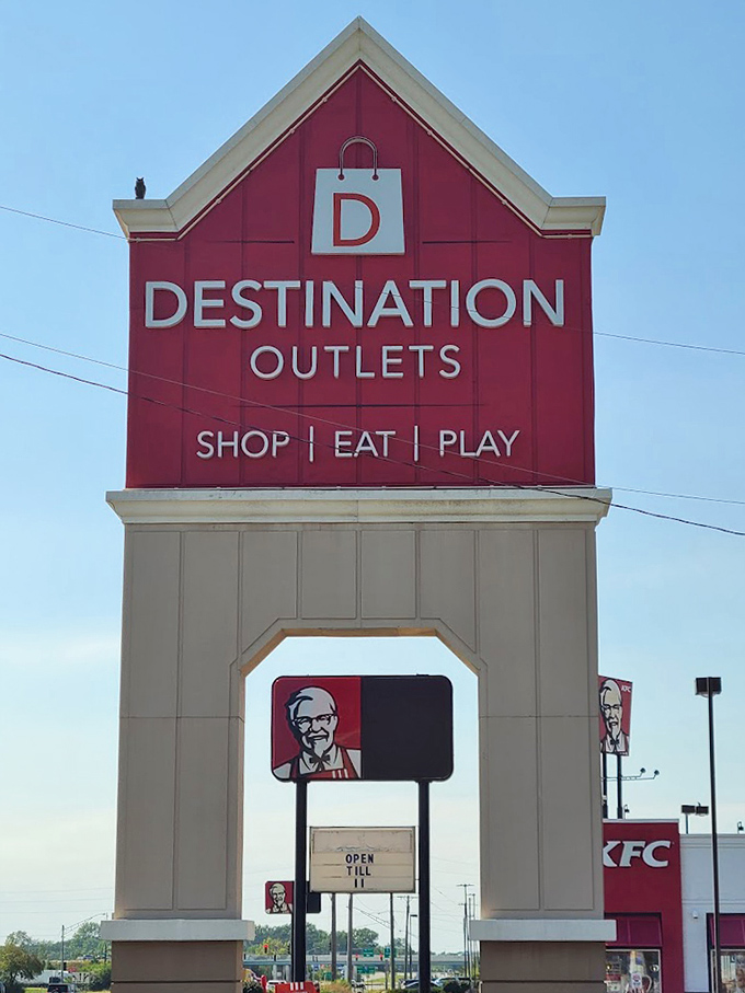 The iconic red barn entrance declares the mall's three-part mission: "Shop | Eat | Play." Your credit card just whispered, "Challenge accepted."