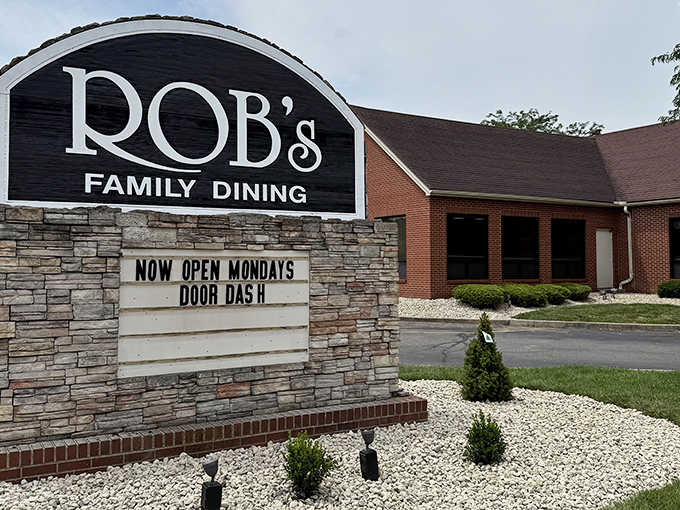 The roadside marquee stands as a beacon of hope for hungry travelers, promising family dining excellence and occasionally announcing modern conveniences like delivery service.