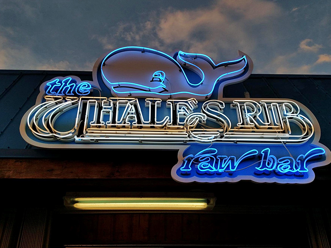 The neon whale sign glows against the twilight sky &ndash; a beacon for hungry travelers and a landmark for locals who know what's good.