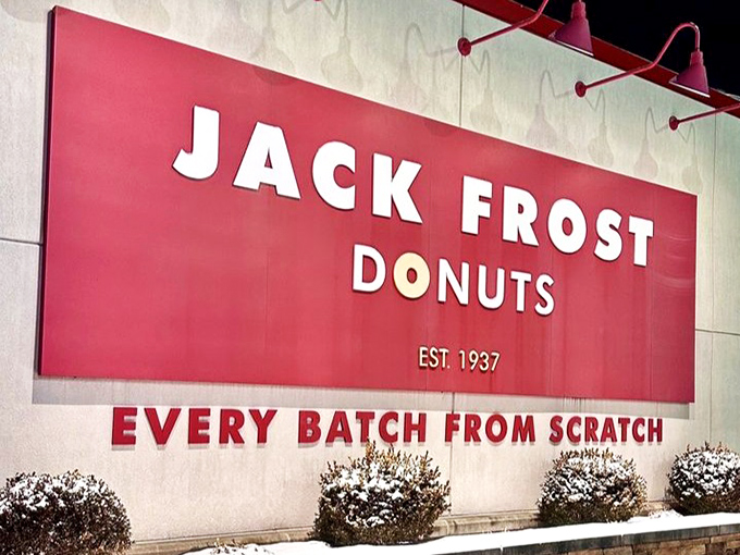 That iconic red sign against winter snow feels like a warm promise. "Yes, we're open, and yes, we have fresh donuts."