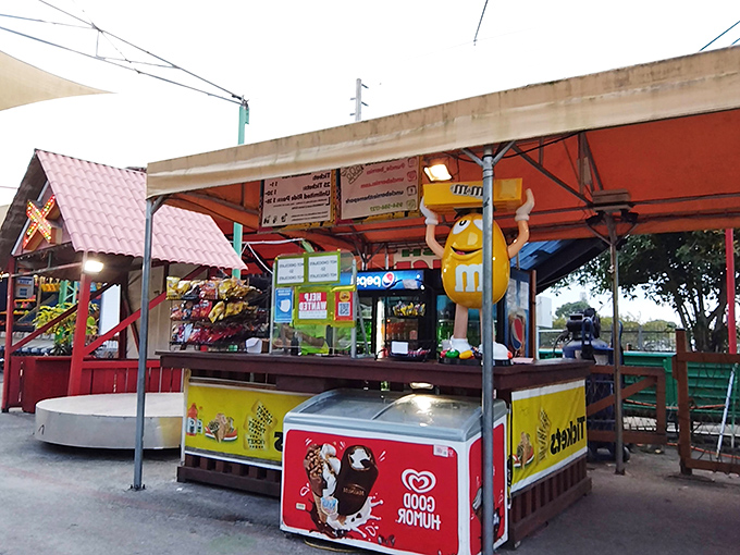 The snack stand, complete with a giant M&M character, proves that serious bargain hunting requires serious refueling options.