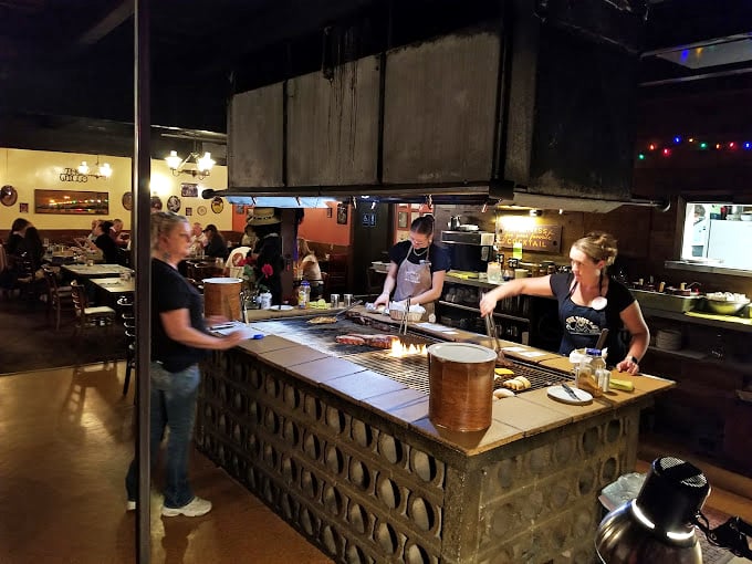 The open grill isn't just cooking&mdash;it's performance art where the staff orchestrates a symphony of sizzles and perfectly timed flips.