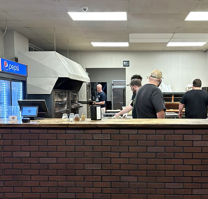 Behind the counter, the staff works with practiced efficiency, turning out rectangular masterpieces that have defined Ambridge's food identity for generations.