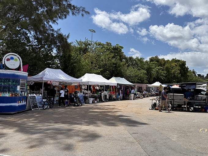 White tents against blue skies create a bazaar atmosphere where one person's castoffs become another's prized possessions.