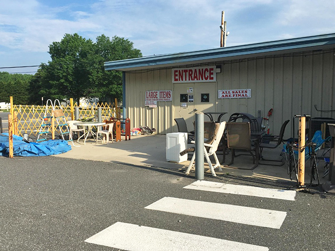 The outdoor entrance showcases furniture finds too substantial for indoor display. That patio set has stories to tell and summer gatherings in its future.