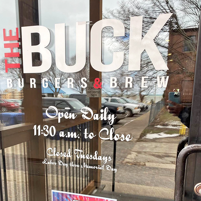 The door promises what awaits inside – daily burger bliss from lunch until close. A simple schedule for a simply wonderful dining experience.