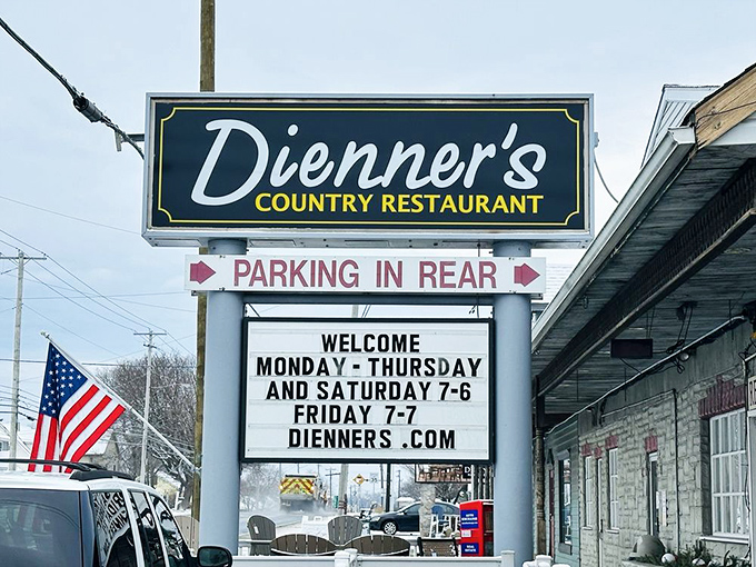 The sign promises hours of operation, but what it's really advertising is "scheduled happiness" for hungry travelers.