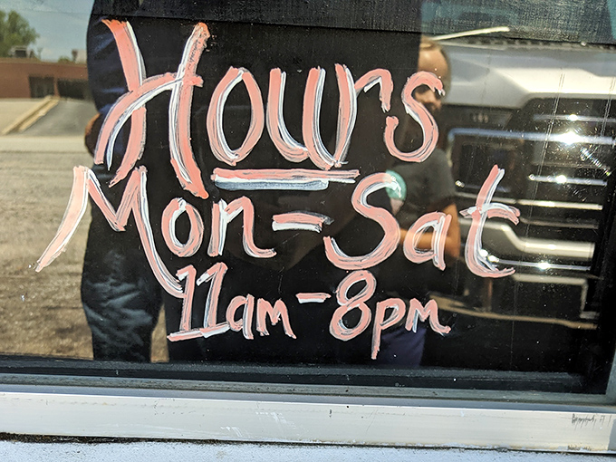 Hours posted with the confidence of a place that knows you'll rearrange your schedule to get there. The handwritten touch says "we're worth planning for."