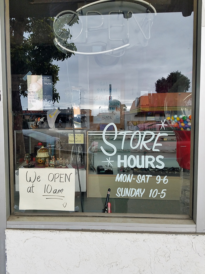 The handwritten store hours sign &ndash; that perfect touch of analog charm in our digital world, complete with a smiley face welcoming early birds.