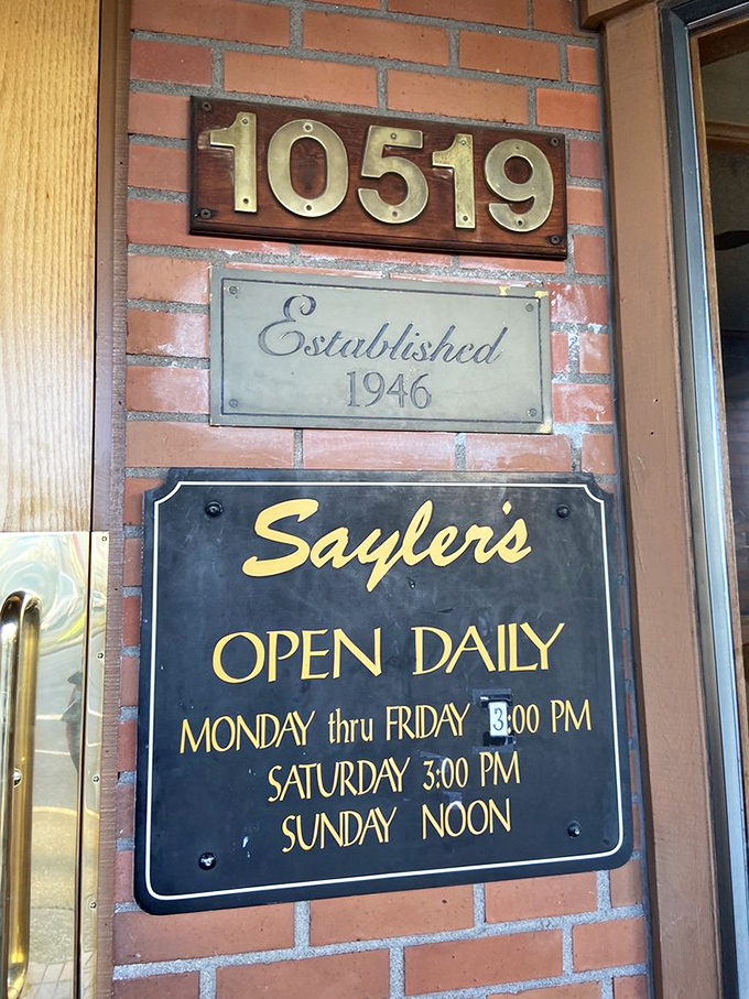 The brass numbers and hours sign&mdash;a portal to simpler times when restaurants didn't need websites, just perfectly cooked ribeyes.